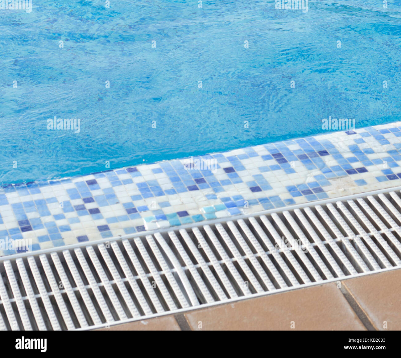 Blue swimming pool on hot sunny day on summer vacation Stock Photo - Alamy