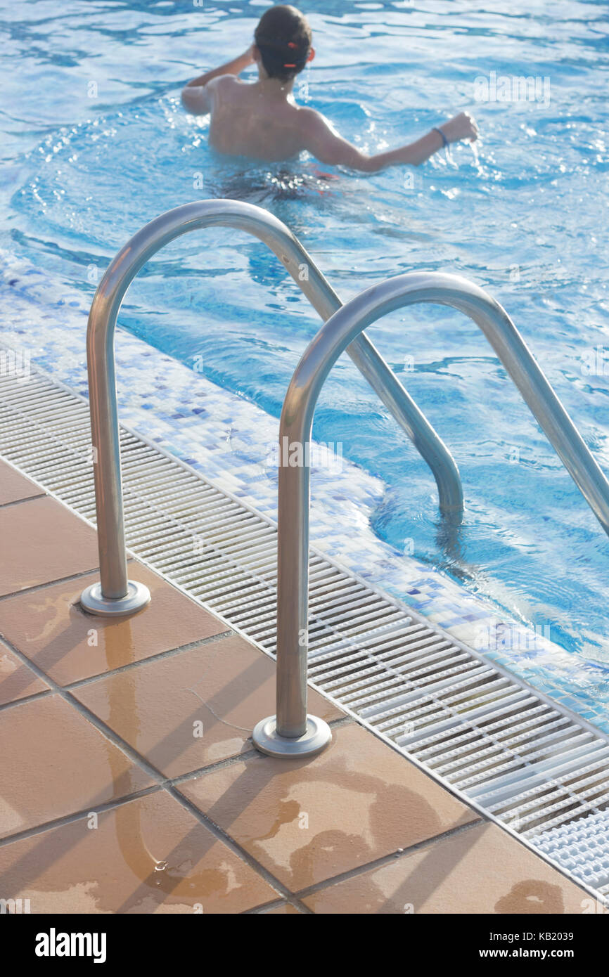 Blue swimming pool on hot sunny day on summer vacation Stock Photo - Alamy