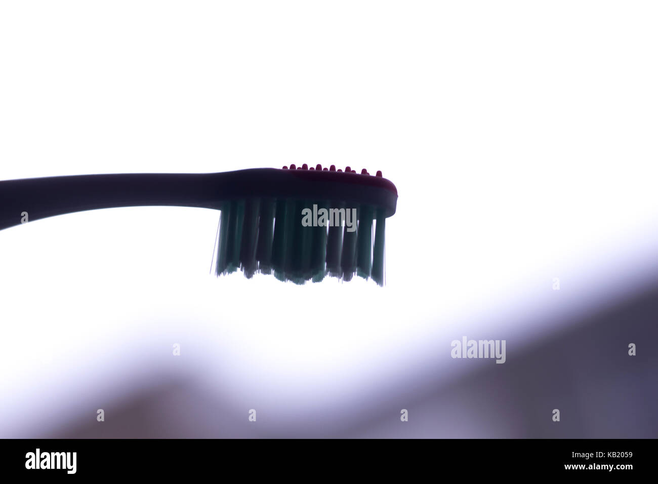 Manual modern tooth brush closeup on plain background Stock Photo - Alamy