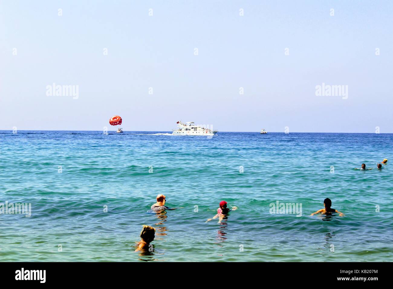 July, 2017 - Vacationers bathe in the sea and sunbathe in the sun on ...