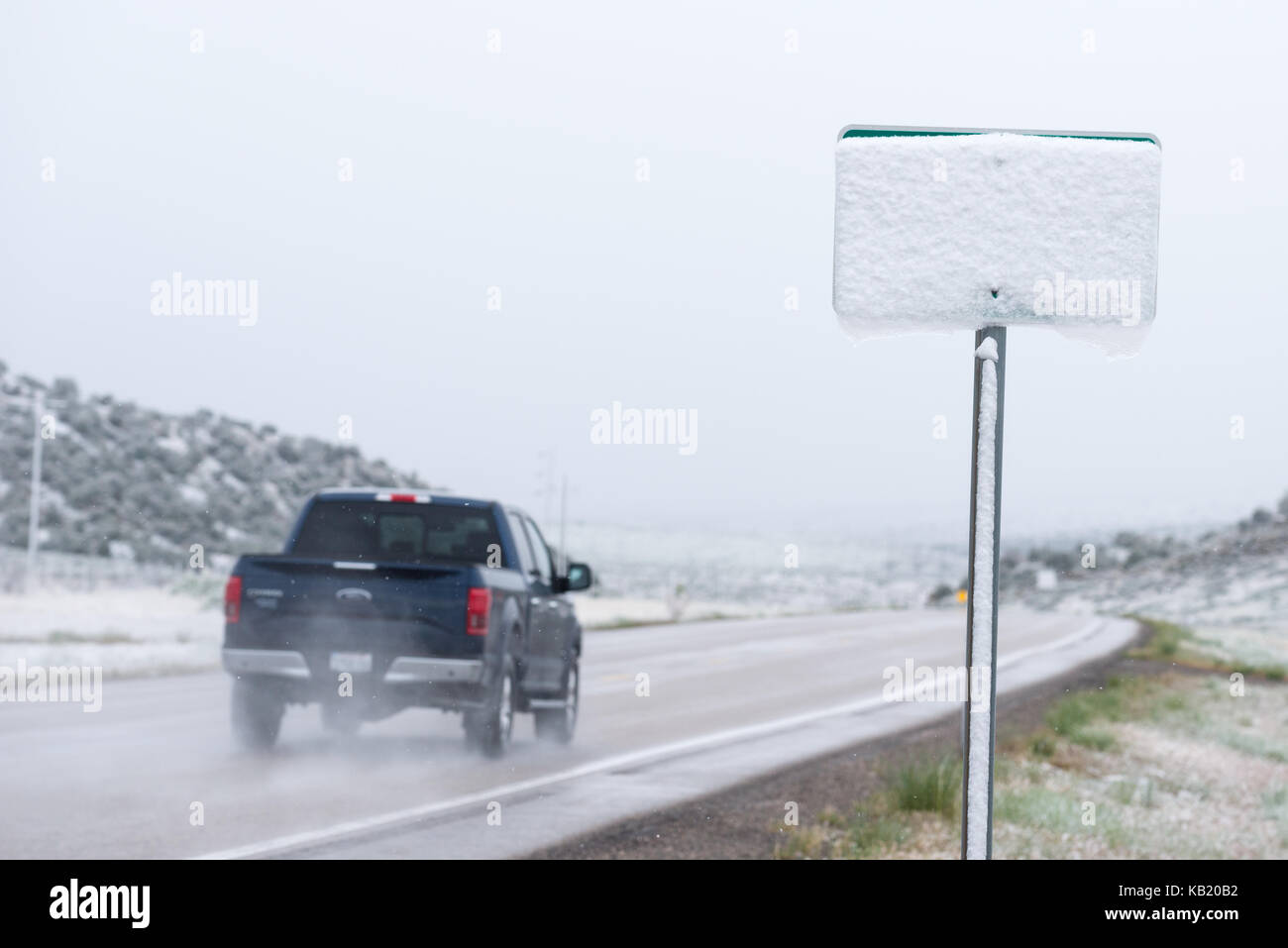 Snow covered highway sign in Utah Stock Photo - Alamy
