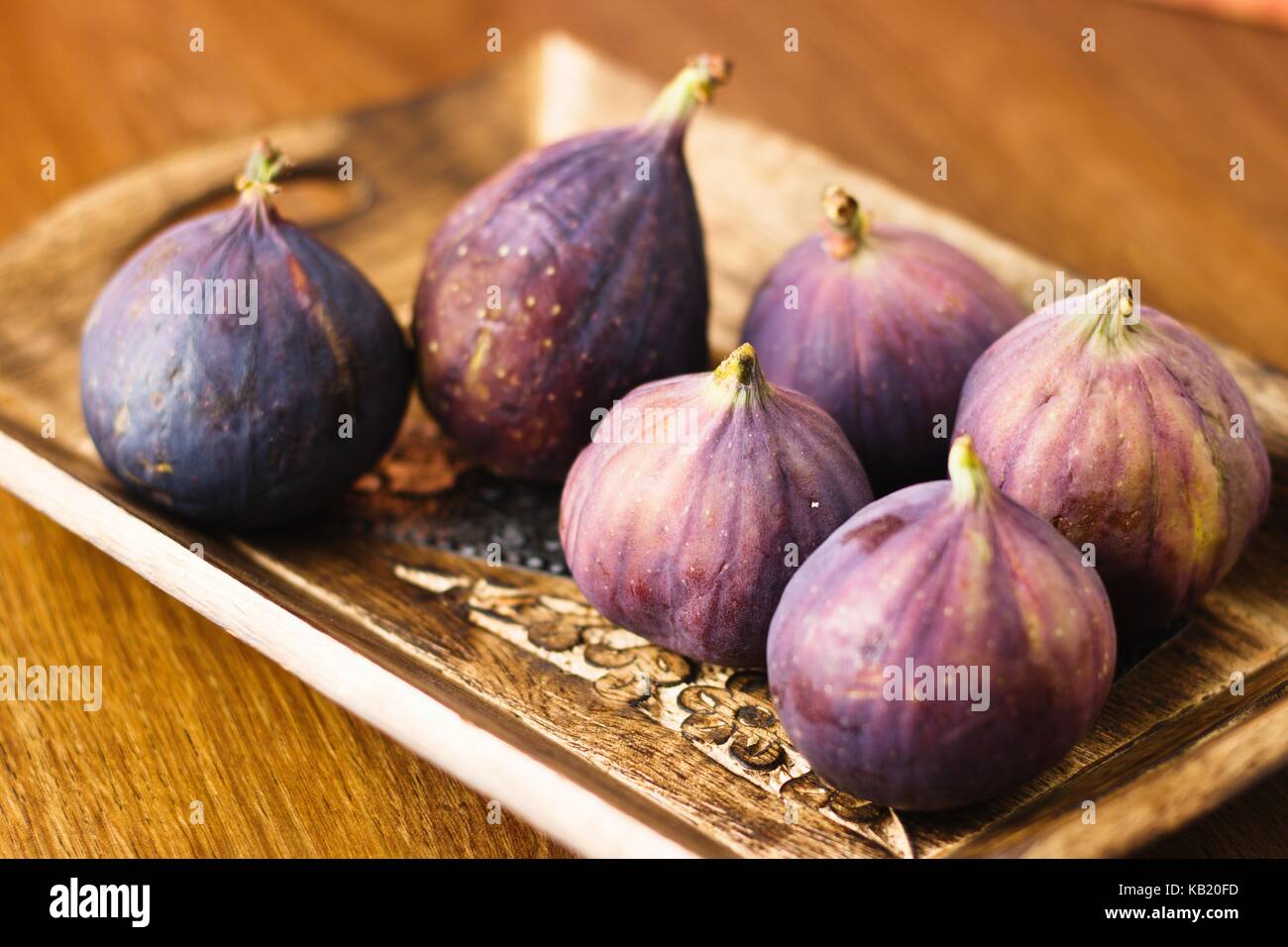 Beautiful ripe figs in rustic decorated wooden bowl Stock Photo - Alamy