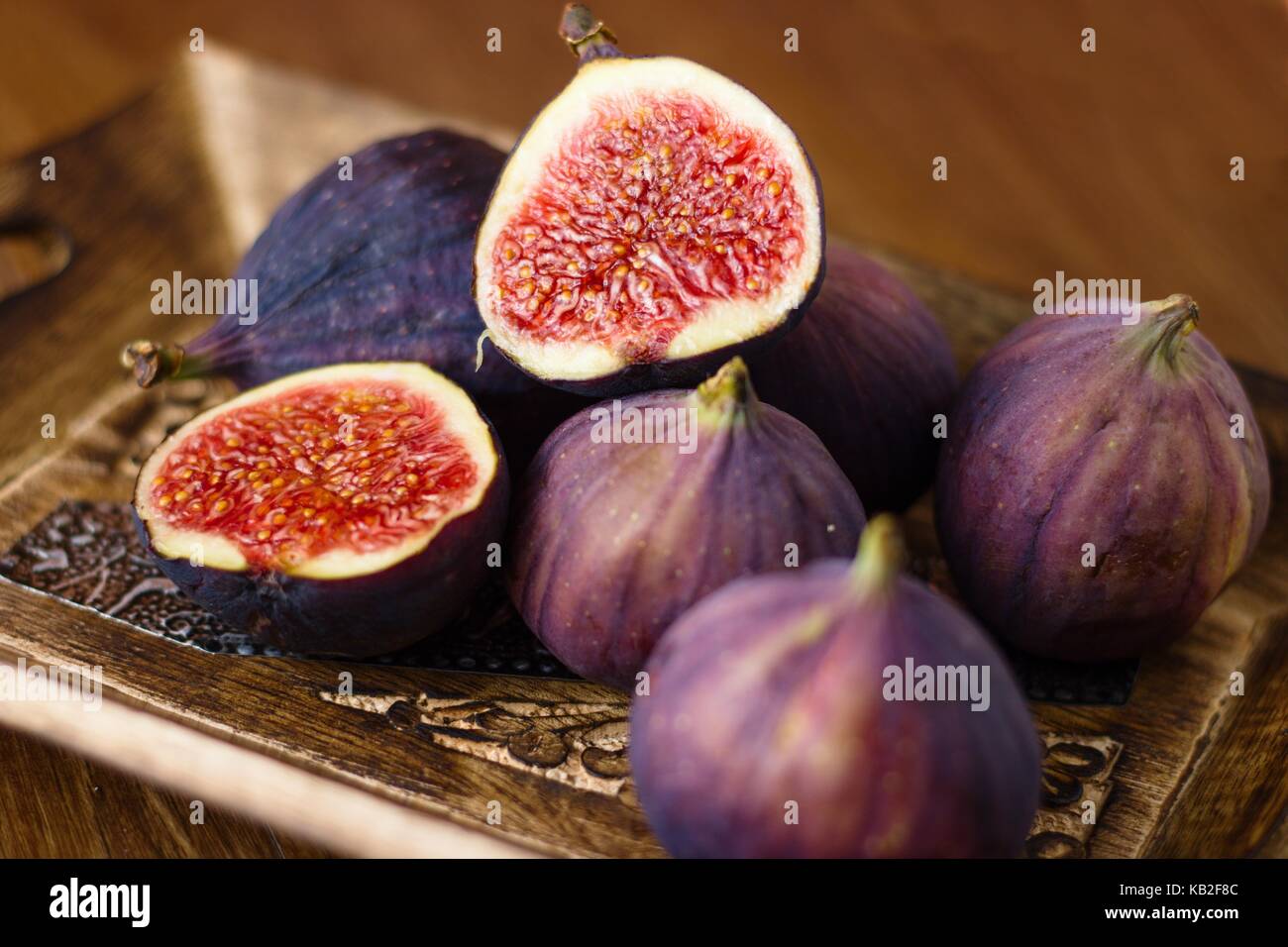 Beautiful ripe figs in rustic decorated wooden bowl Stock Photo - Alamy