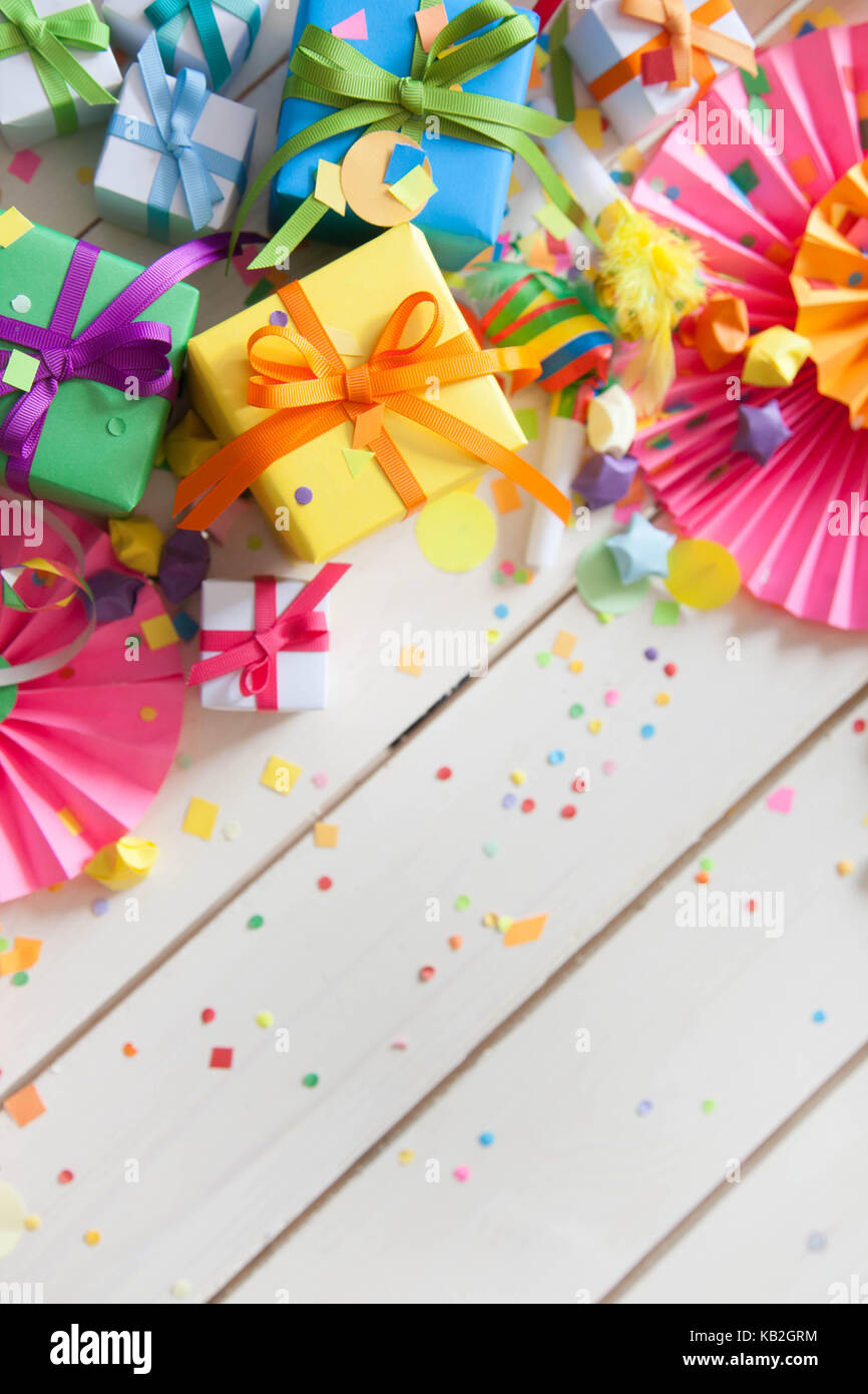 Colored gift boxes with colorful ribbons. White background. Gifts for ...