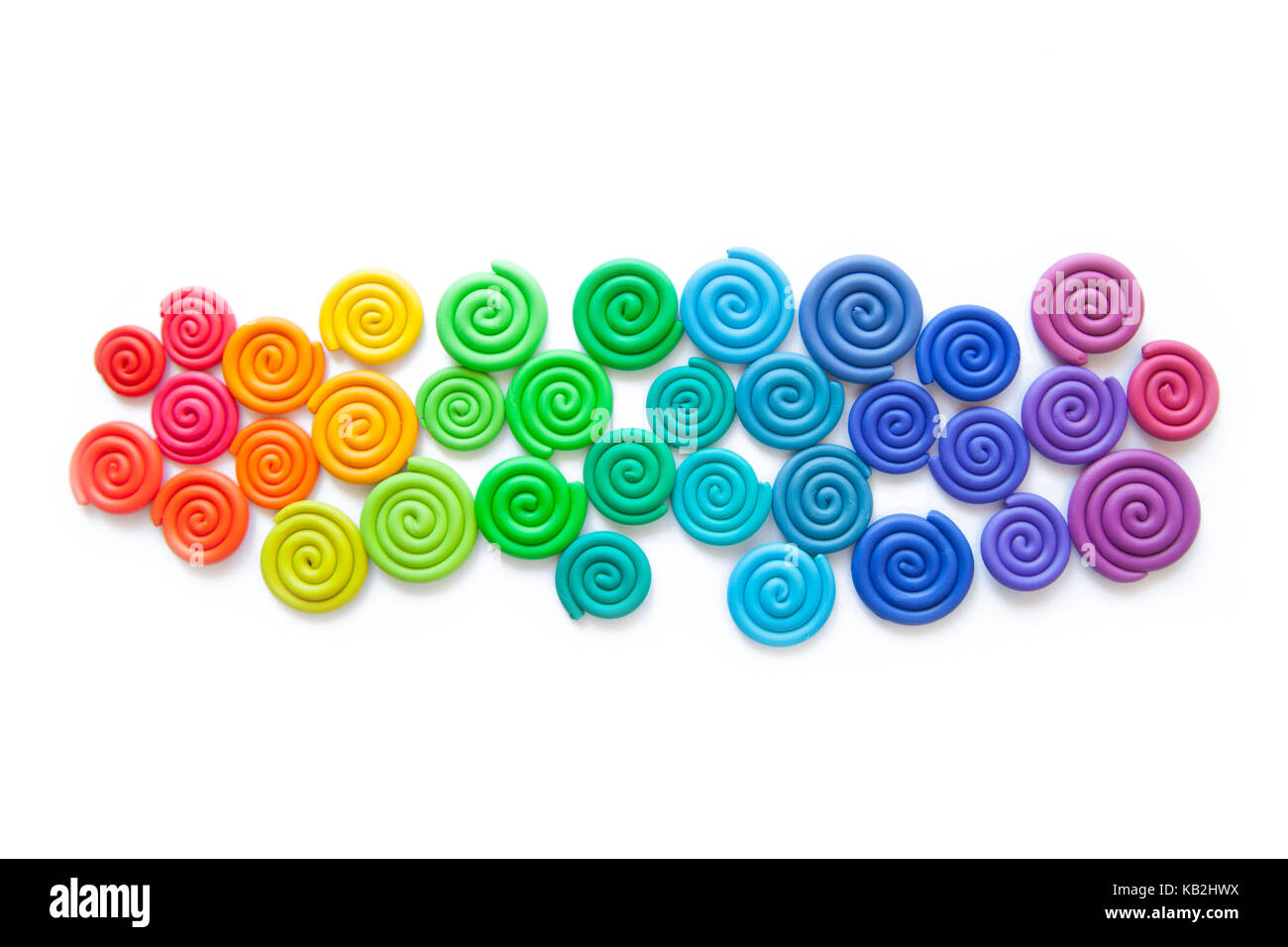 Background of plasticine. Twisted colored spirals of plastic of ...