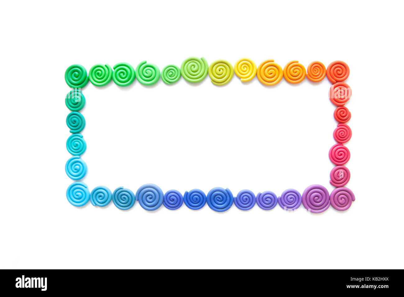Frame made of plasticine. Twisted colored spirals of plastic of ...