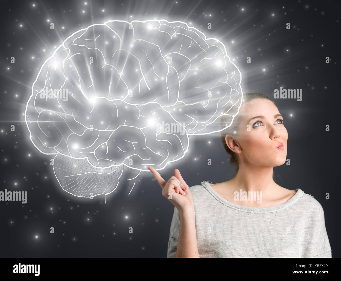 Young girl thinking with illustrated brain Stock Photo - Alamy
