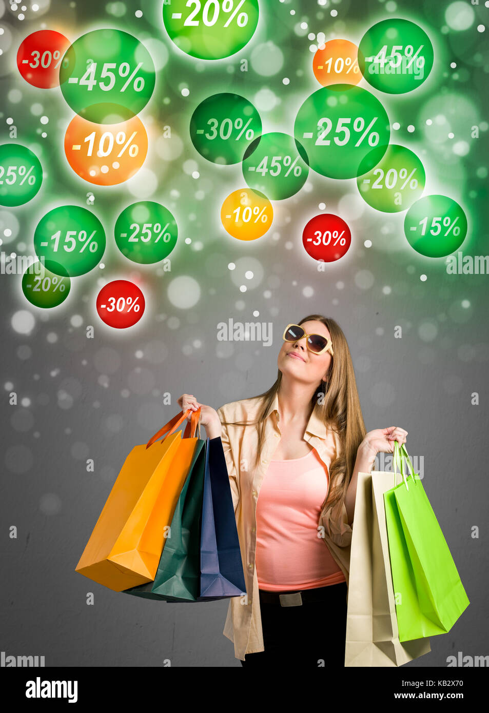 Shopping woman looking at labels discounts percent Stock Photo - Alamy