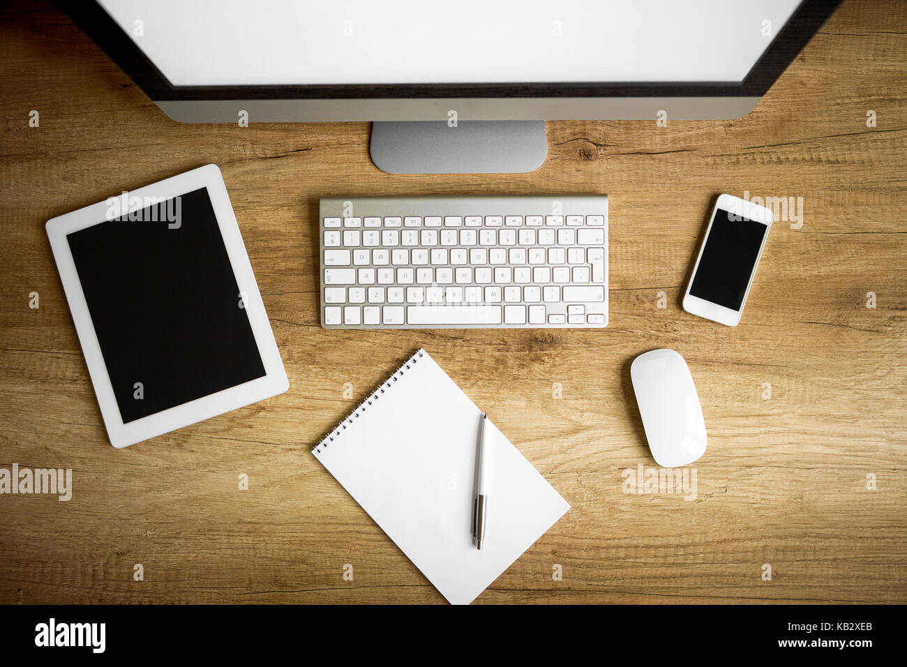 Office supplies, gadgets on wooden table, top view Stock Photo - Alamy