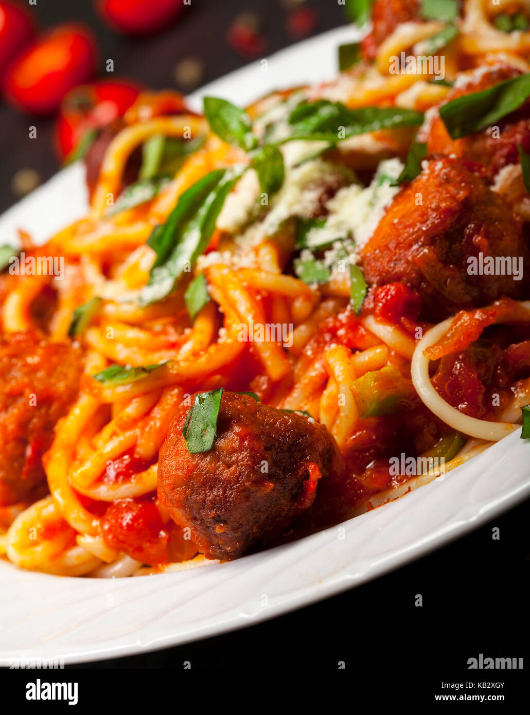 Spaghetti pasta with meatballs and tomato sauce on black background ...