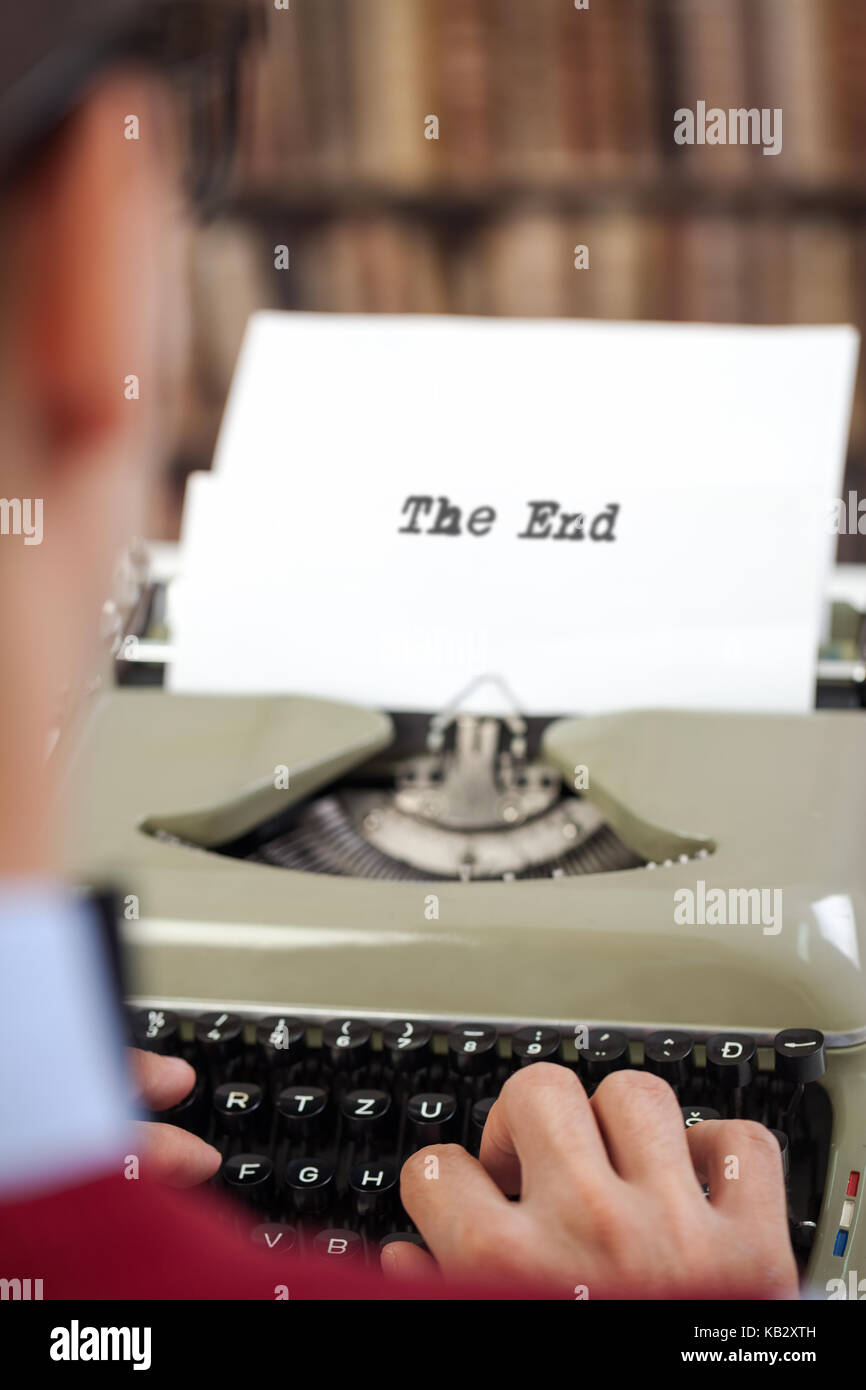 writer typing the end title on the typewriter Stock Photo - Alamy