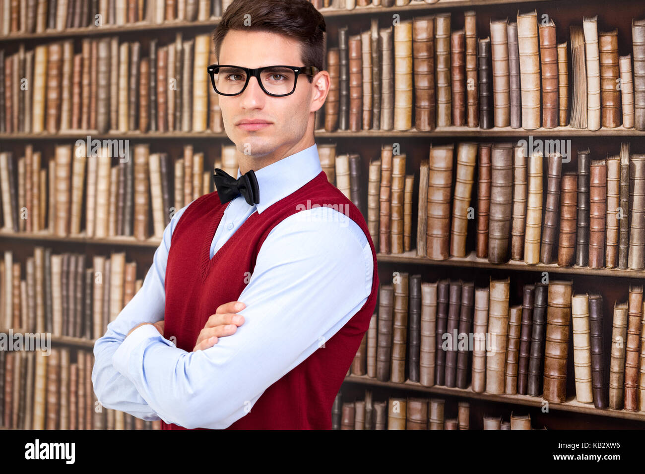 Handsome student in school uniform standing library Stock Photo - Alamy