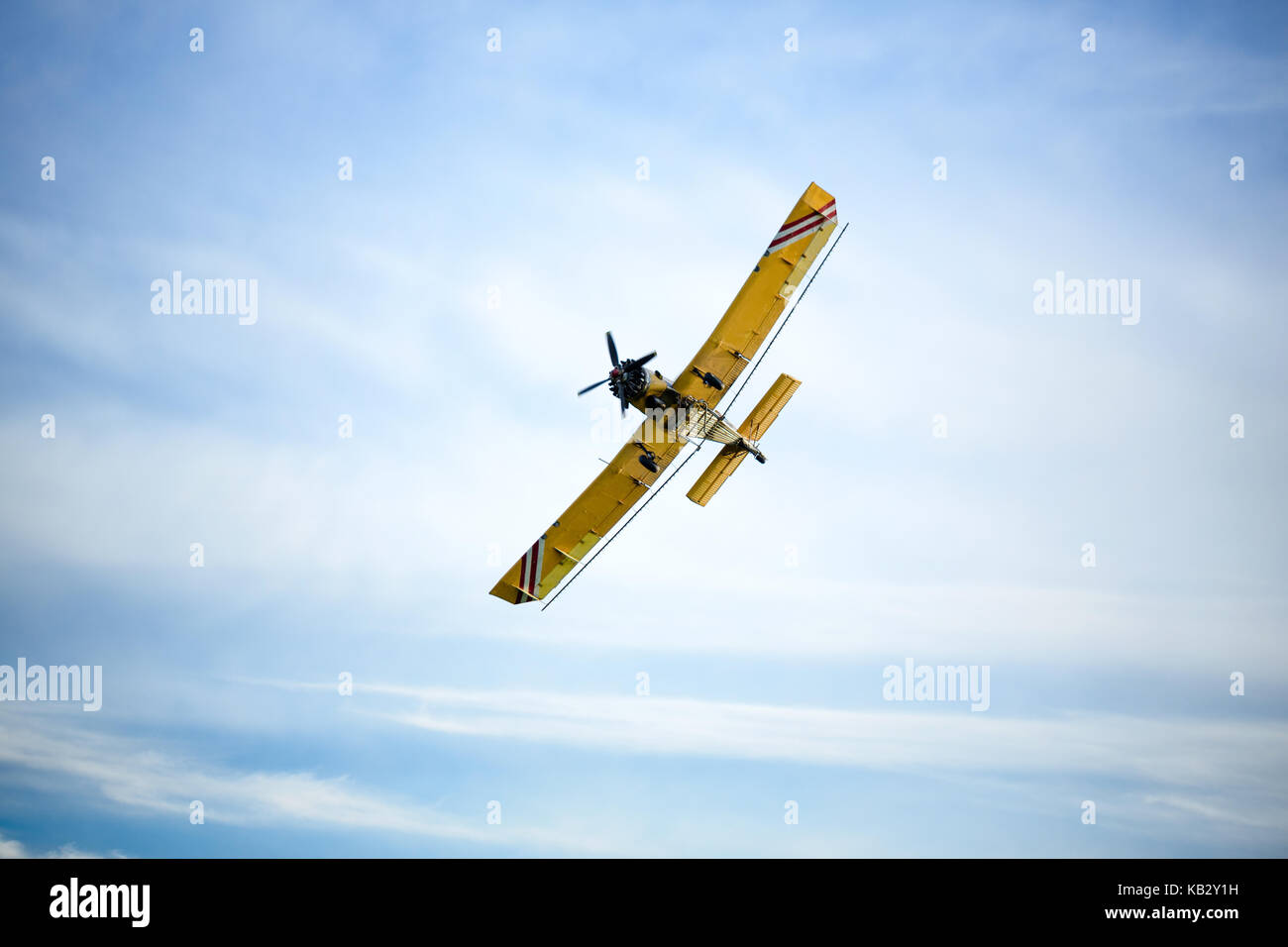 beautiful yellow aircraft is flying in the sky Stock Photo - Alamy