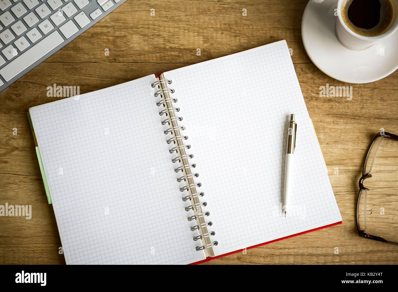 work desk with open notebook above Stock Photo - Alamy
