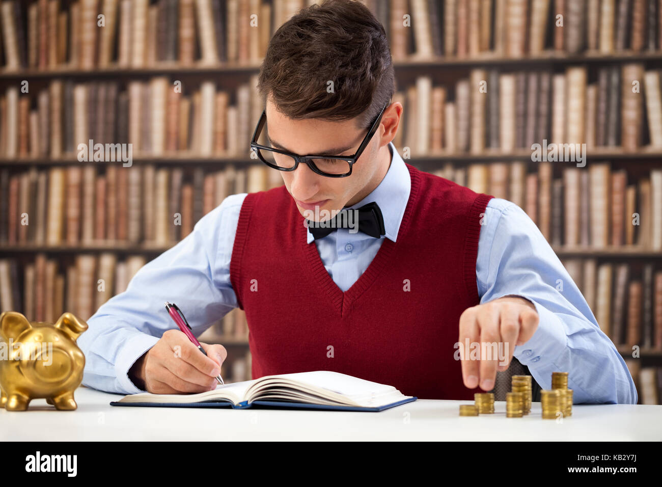 Accountant making note and counting money Stock Photo - Alamy