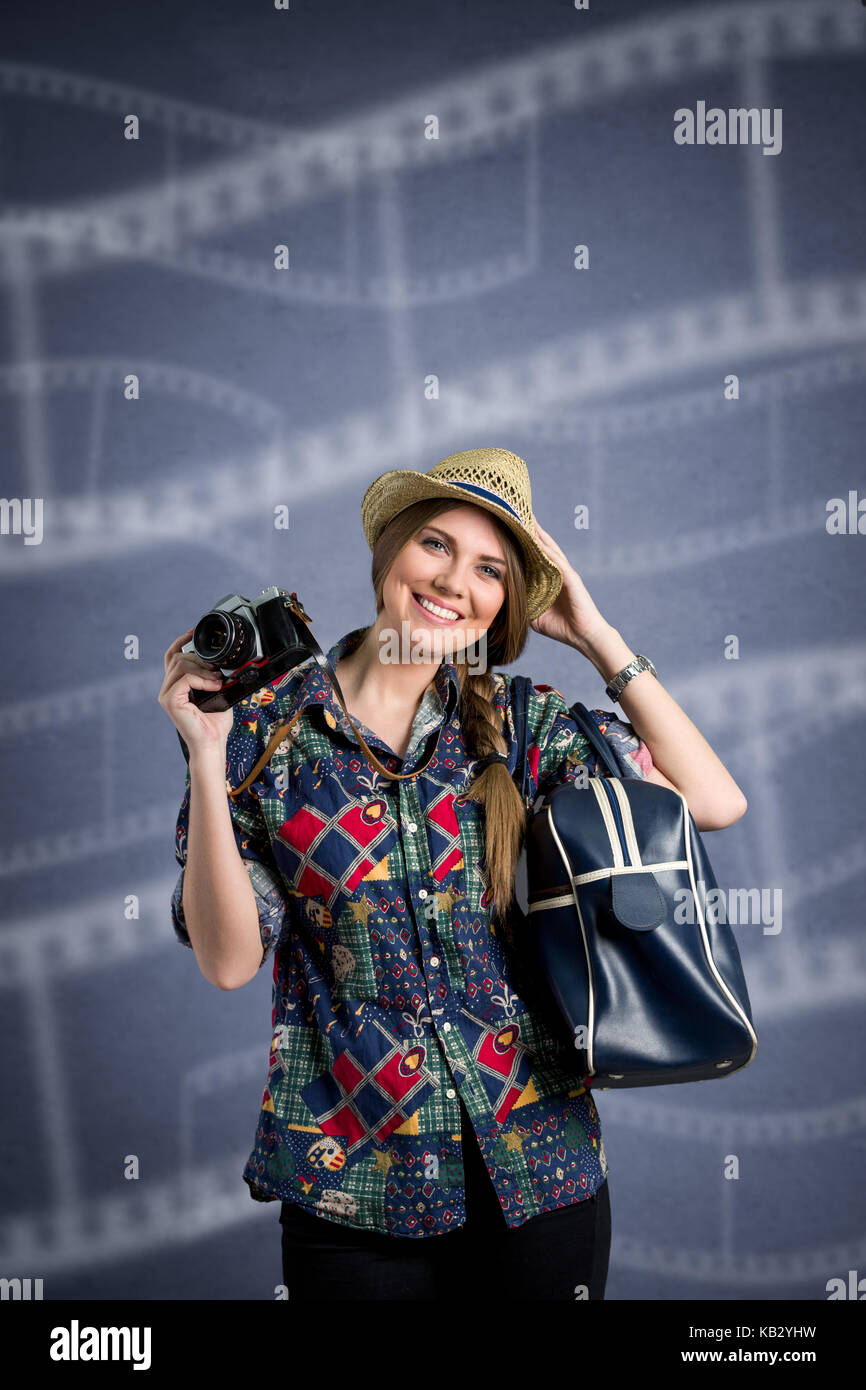 Young happy photographer over design background Stock Photo - Alamy
