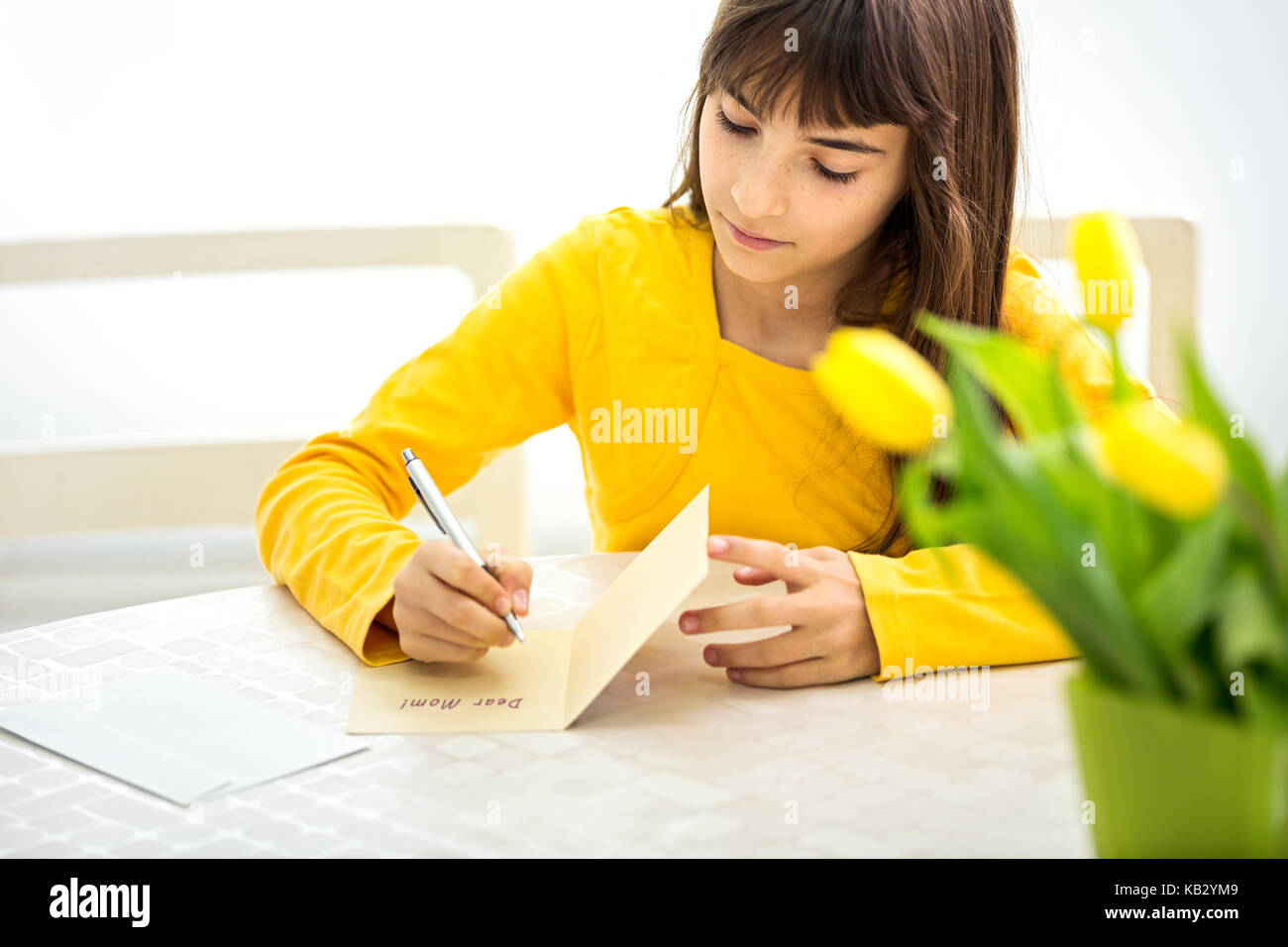 cute little girl making a card for her mom Stock Photo - Alamy