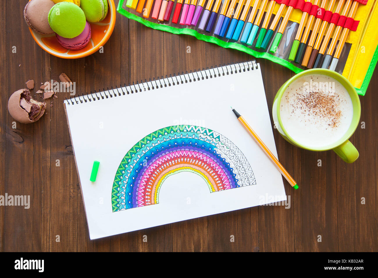 Girl draws a rainbow. Positive drawing. Art therapy and relaxation ...