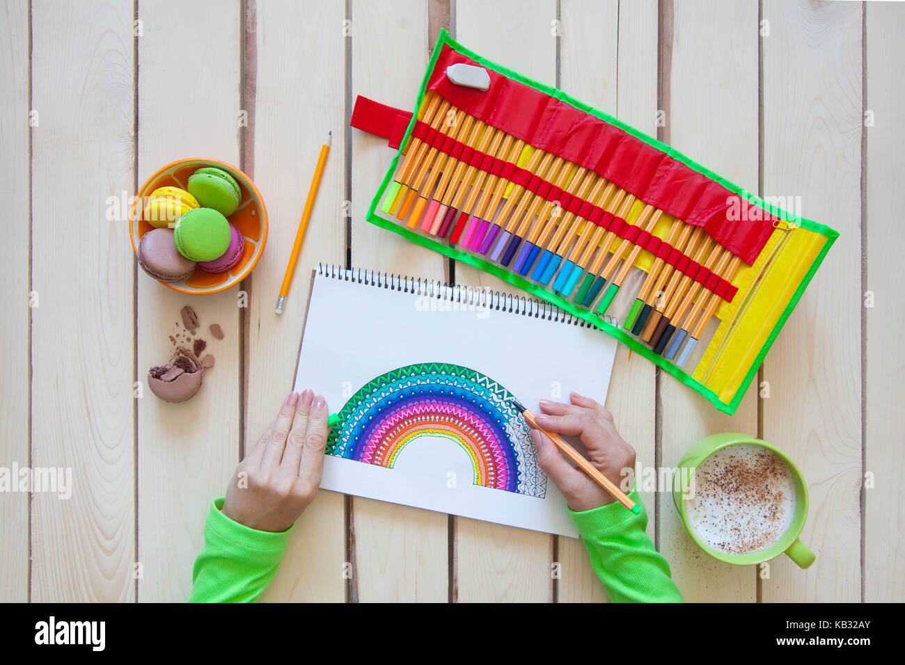 Girl draws a rainbow. Positive drawing. Art therapy and relaxation ...