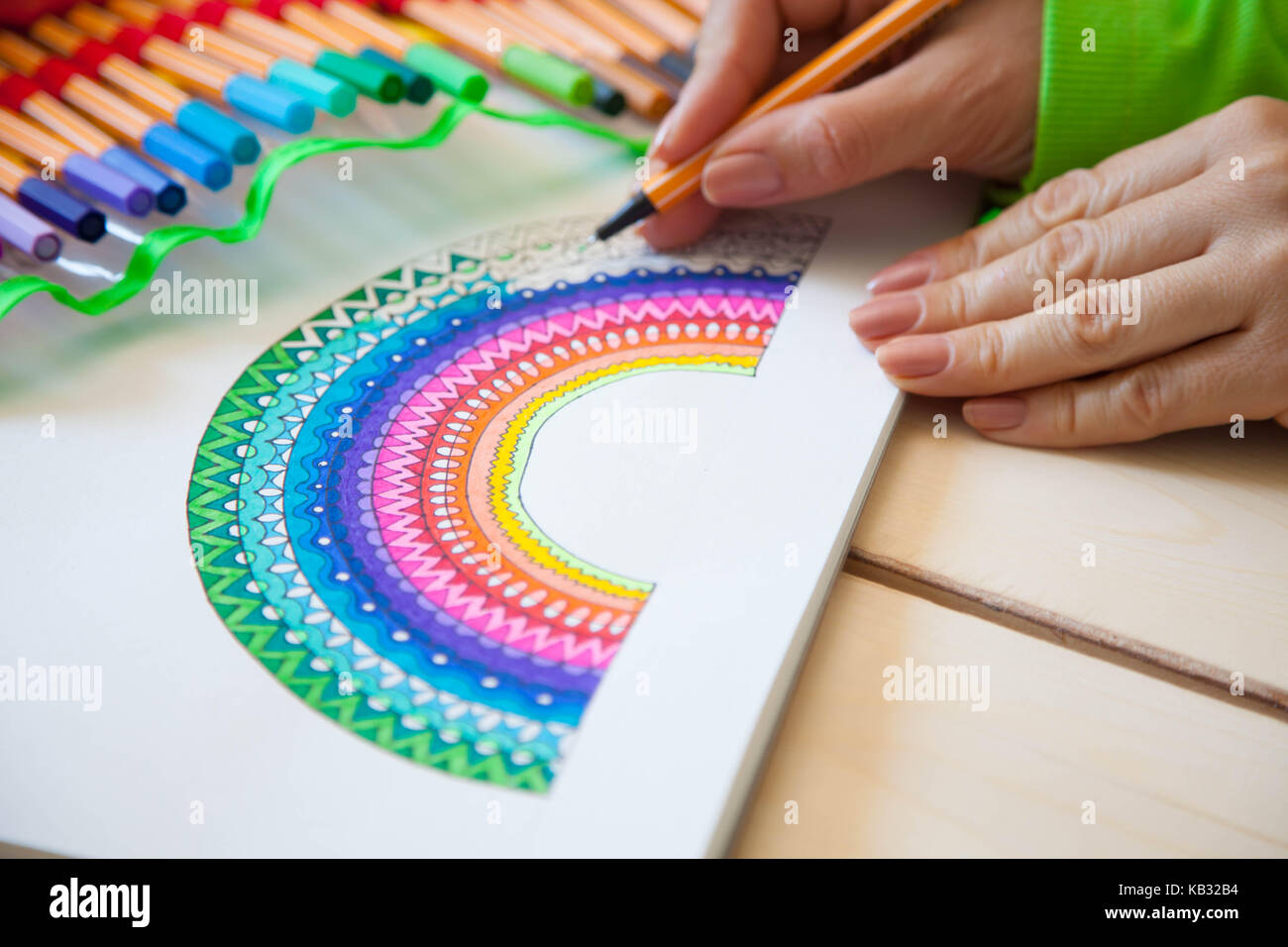 Girl draws a rainbow. Positive drawing. Art therapy and relaxation ...