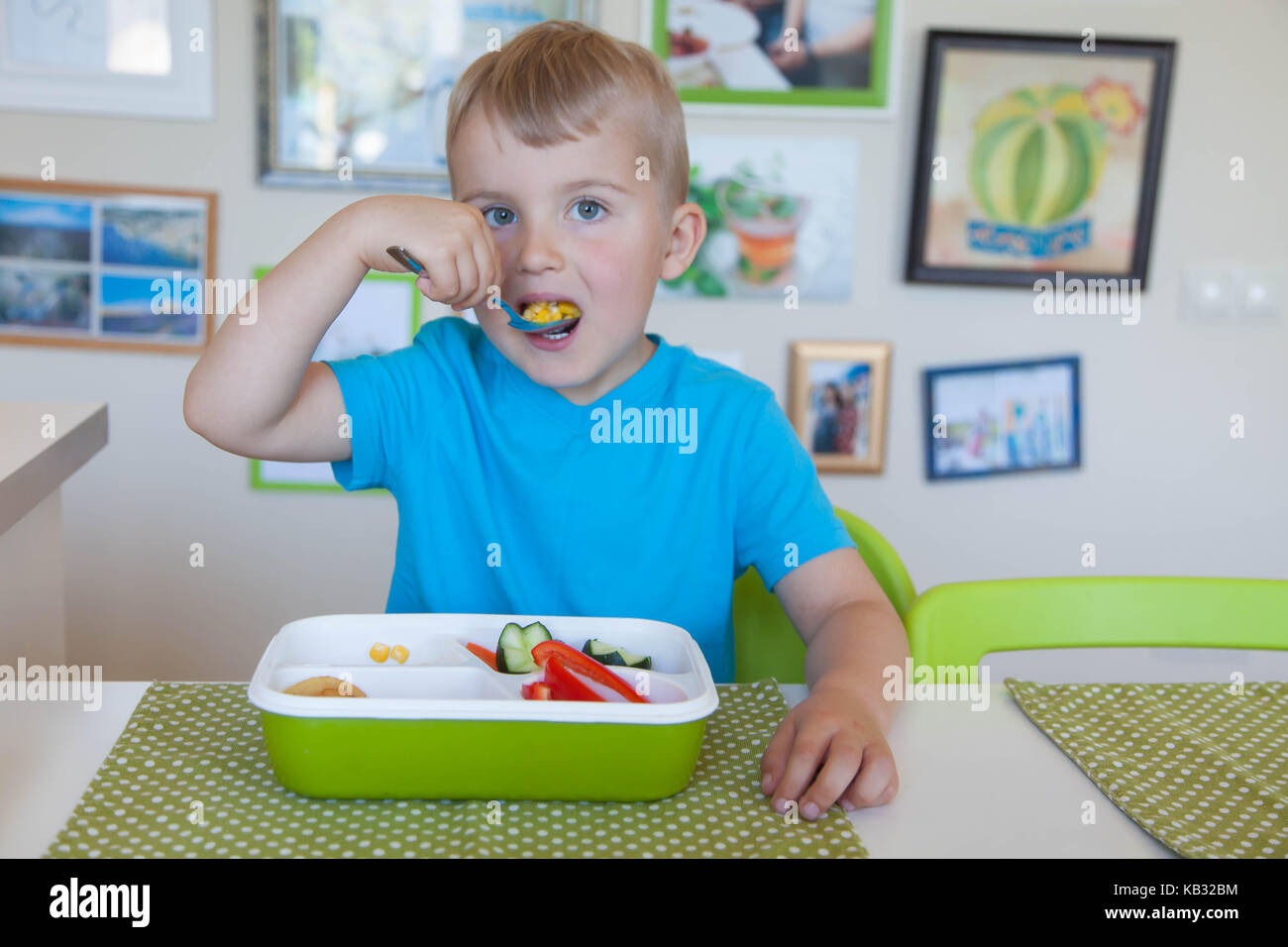 Child boy eating fresh vegetable salad Stock Photo - Alamy
