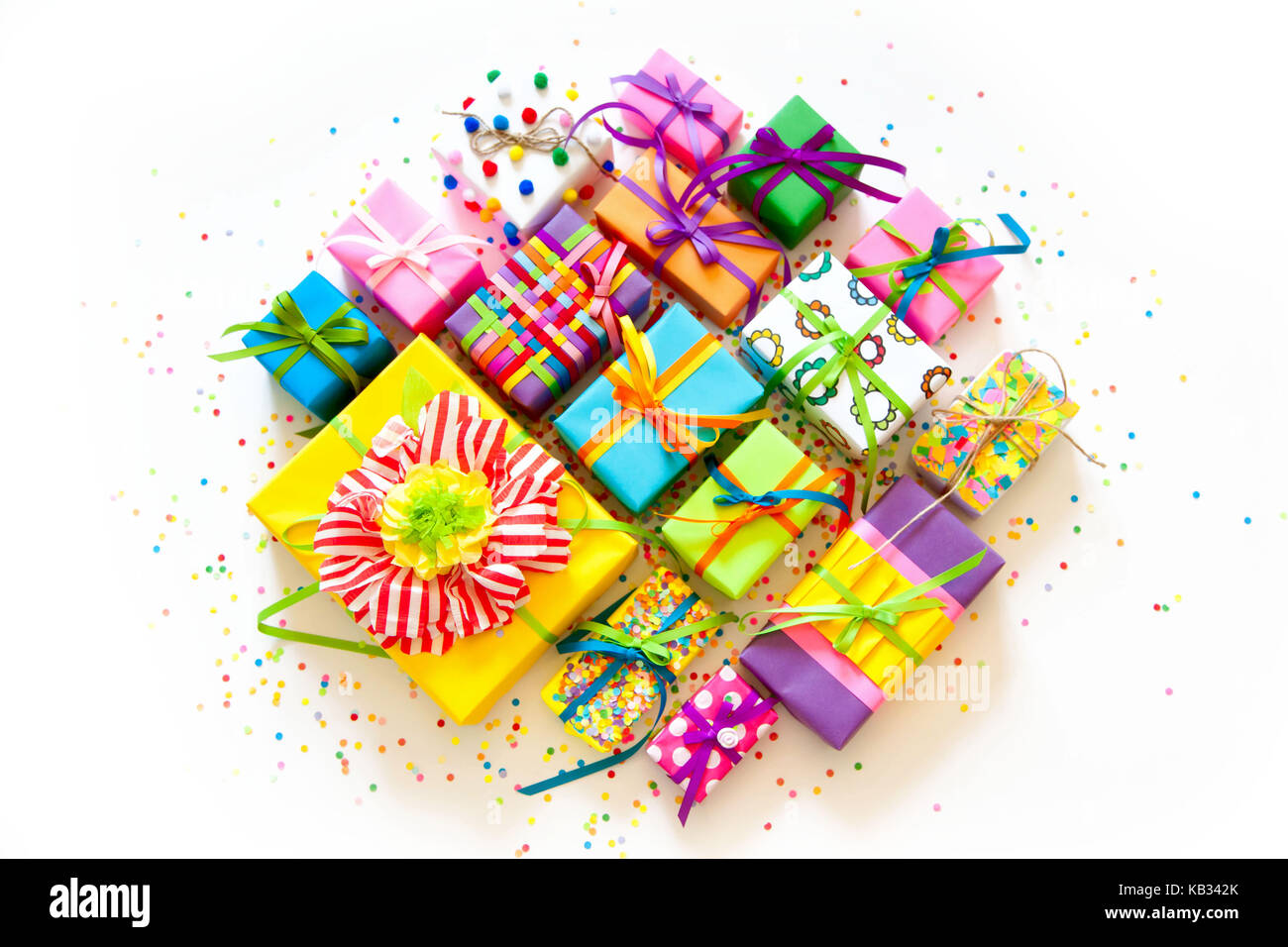 Colored gift boxes with colorful ribbons. White background. Gifts for ...