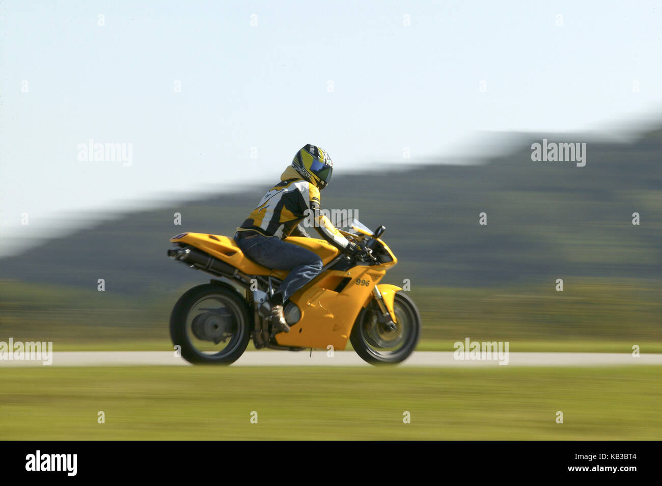 Moving motorcycle on the country road, motion blur Stock Photo - Alamy