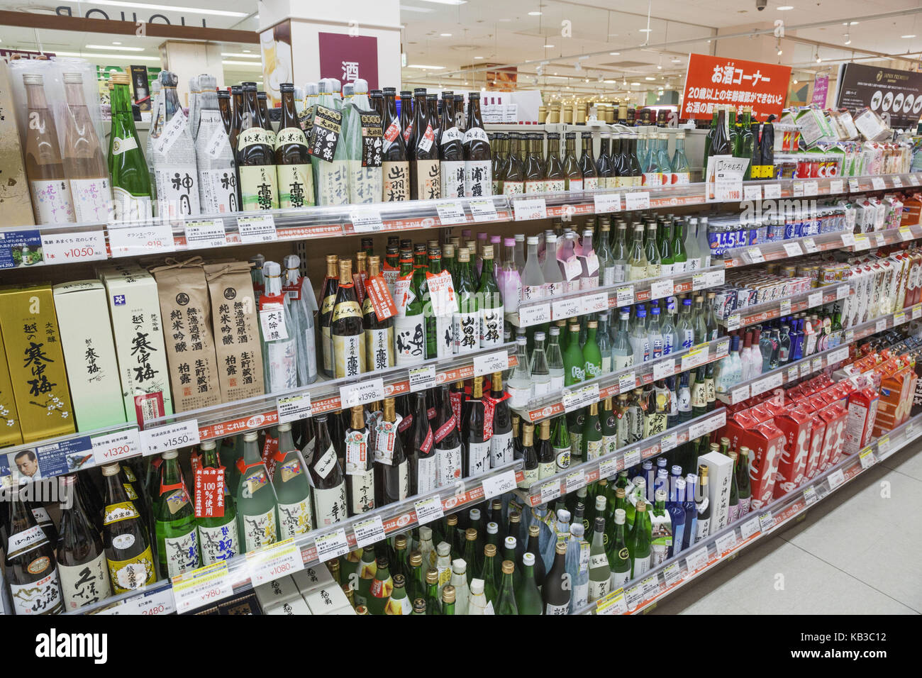 Japan, Honshu, Tokyo, supermarket, inside, shelf with sake and sake ...