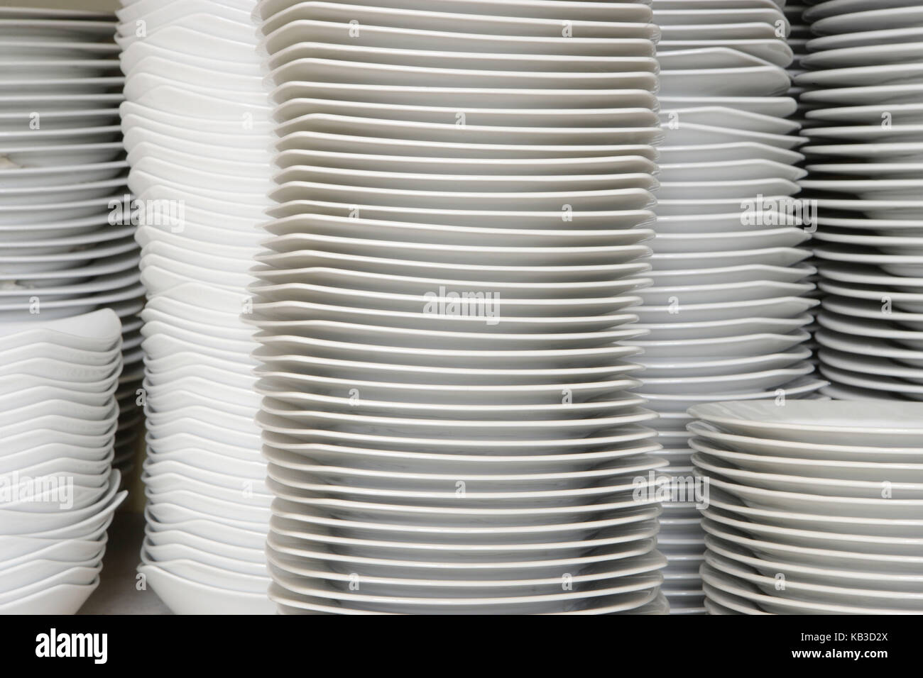 Dishes, plate, stacked, medium close-up Stock Photo - Alamy