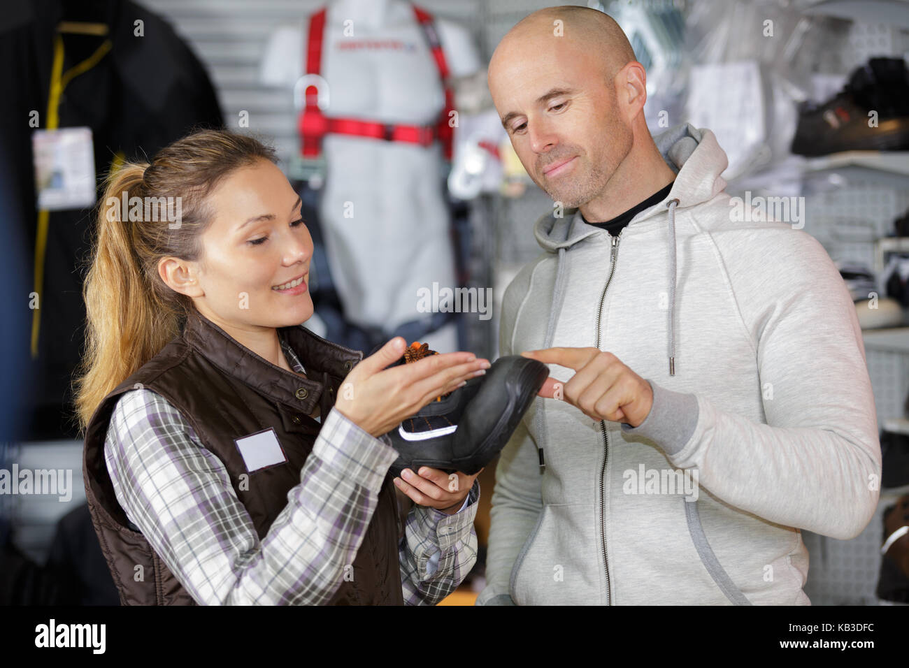 entertaining the client in the shop Stock Photo - Alamy