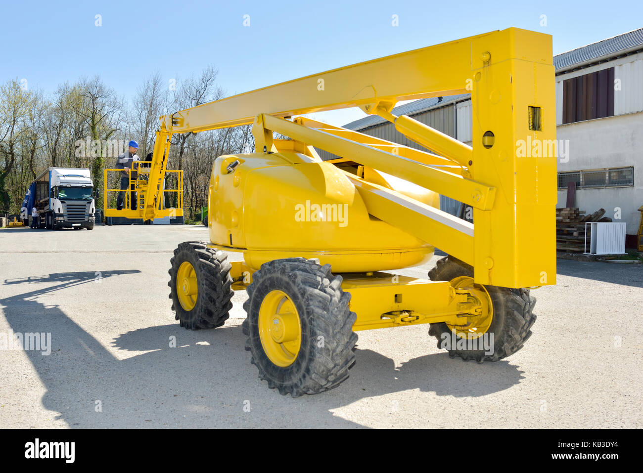 yellow lift loader platform Stock Photo - Alamy