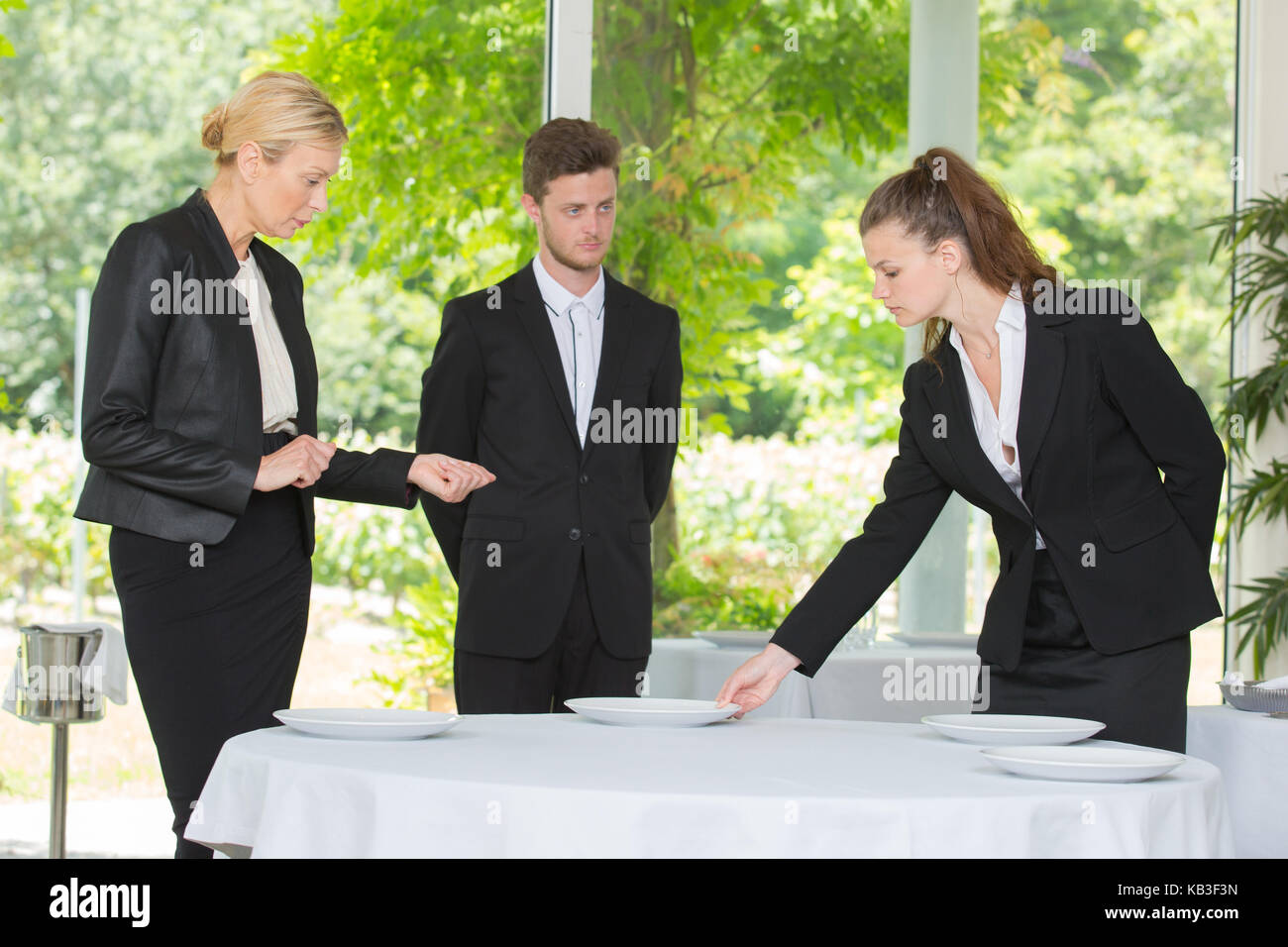 restaurant manager supervises work Stock Photo - Alamy