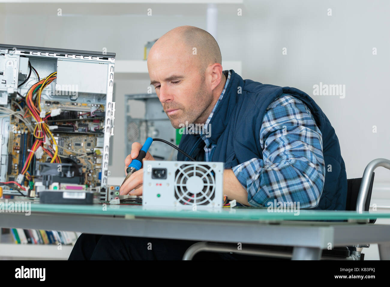 computer engineer working on broken console Stock Photo - Alamy