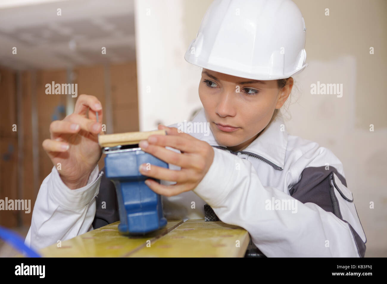 woman builder inspecting the broken tool Stock Photo - Alamy