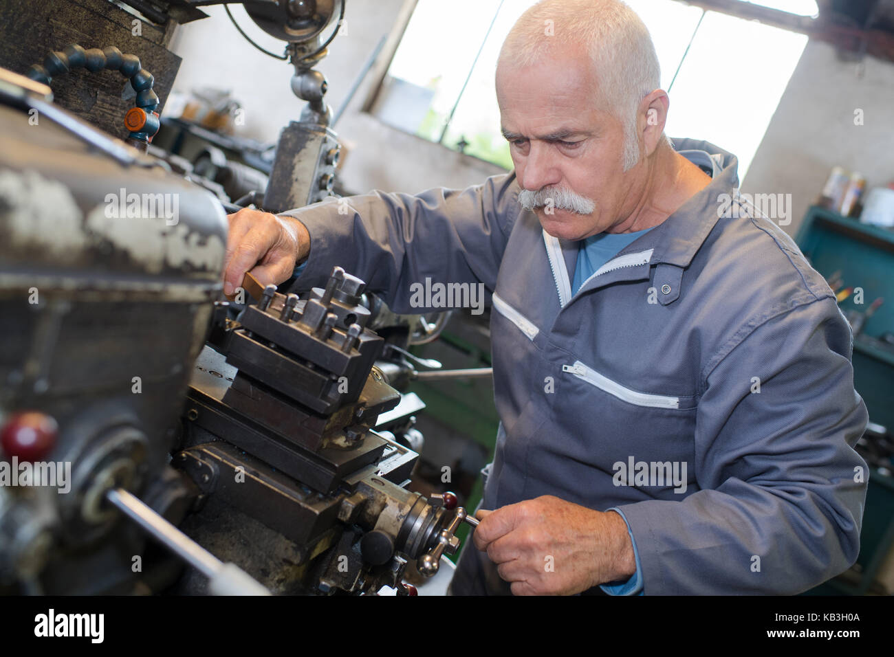 senior worker at a metal factory Stock Photo - Alamy