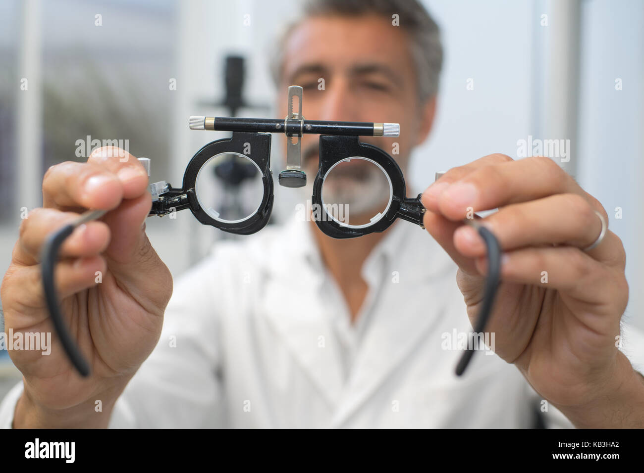 someone about to test glasses with optician Stock Photo - Alamy