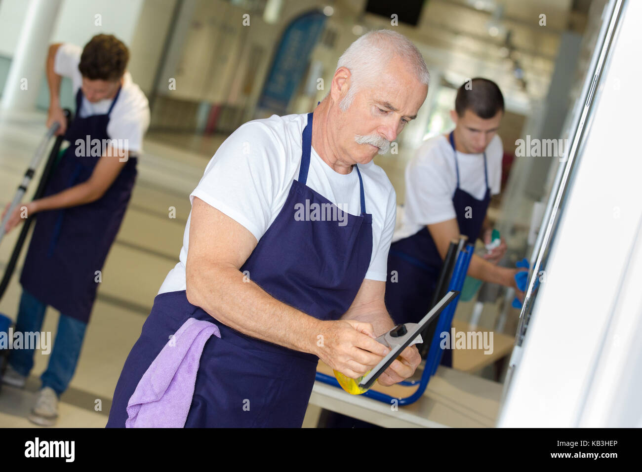 cleaners working with cleaning equipments Stock Photo - Alamy