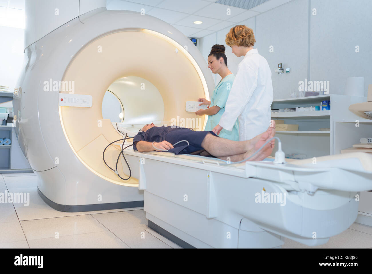 doctor preparing patient for mri scan in hospital Stock Photo - Alamy