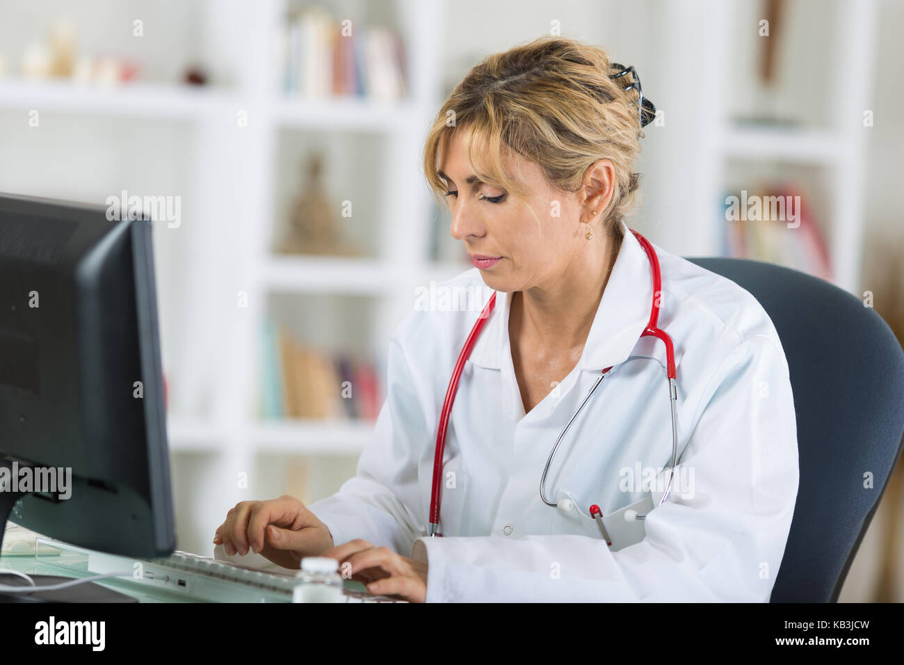 doctor working in her office Stock Photo - Alamy