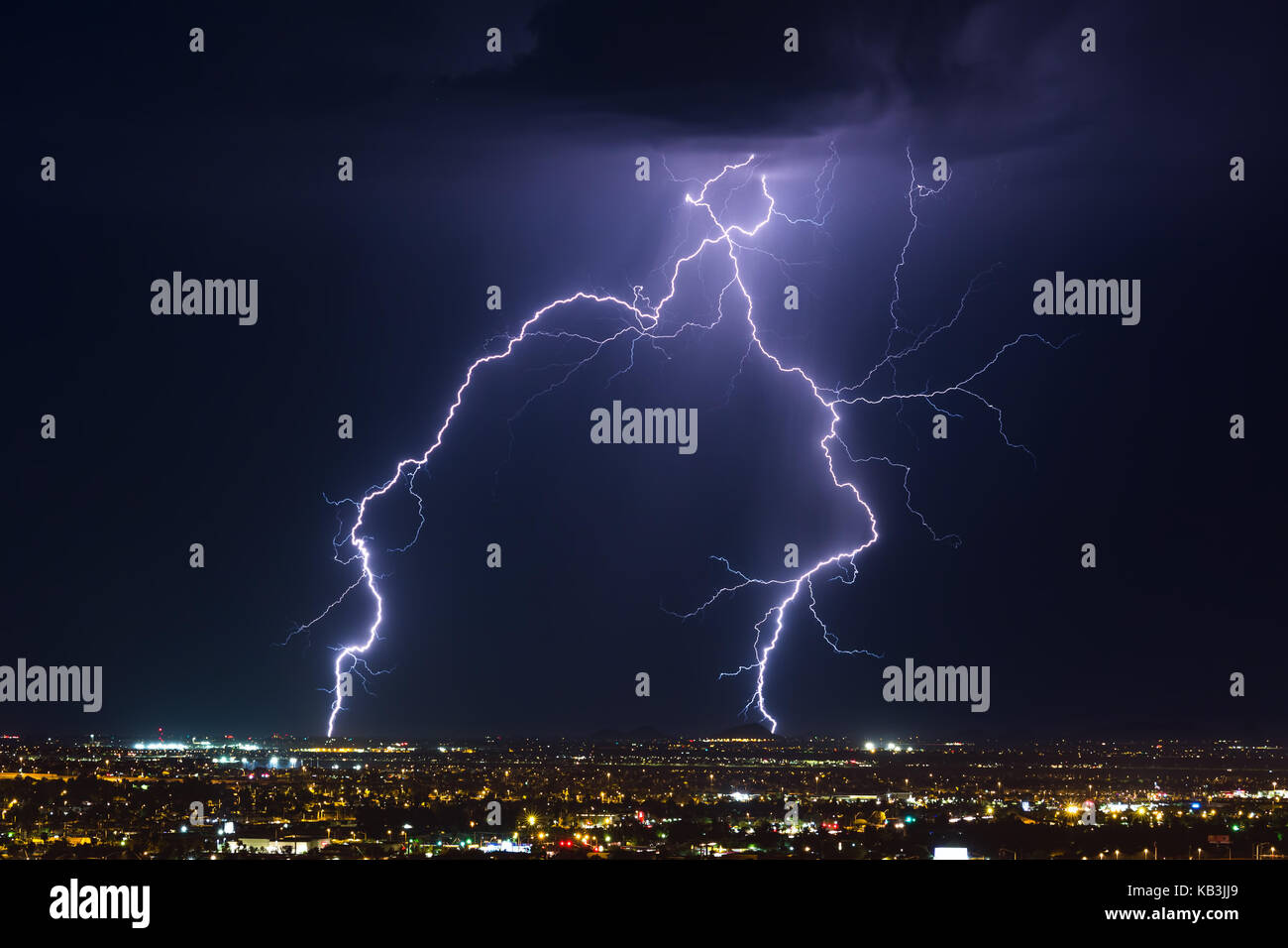 Monsoon storm with bright lightning bolts striking the city in Phoenix ...