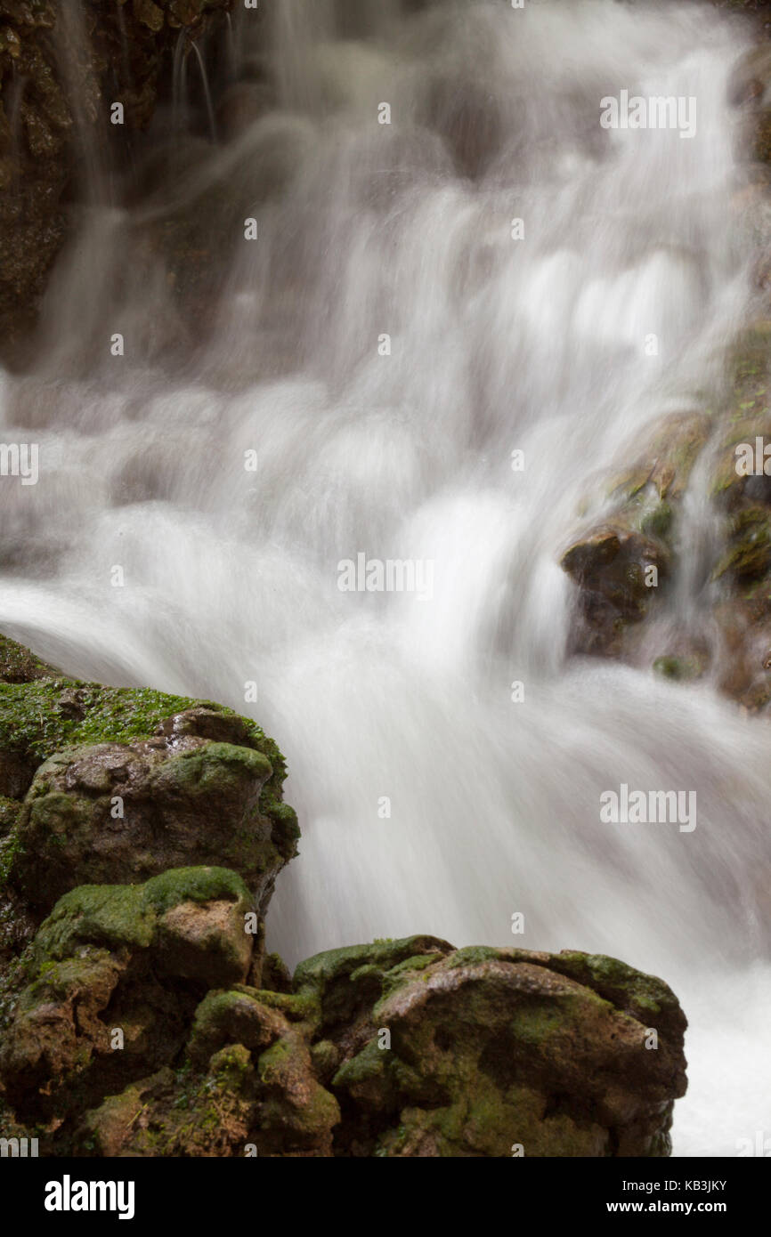 Stream blurred water in small waterfall Stock Photo - Alamy