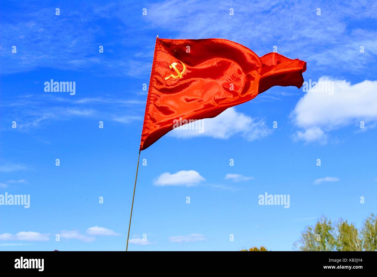 Waving flag of the USSR against the blue sky Stock Photo - Alamy
