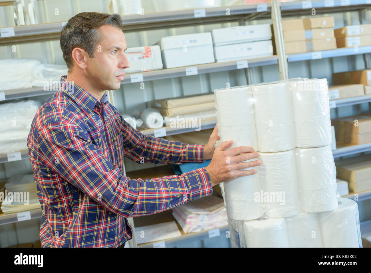 warehouse worker transporting paper Stock Photo - Alamy