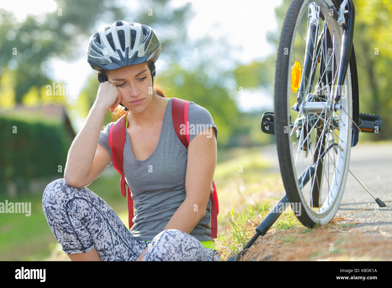 young woman fell off mountain bike Stock Photo - Alamy