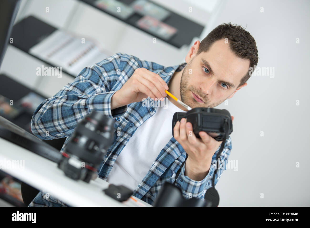 maintenance of photo camera at workshop Stock Photo - Alamy