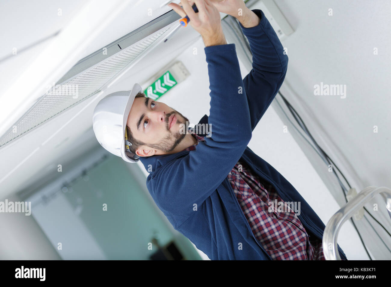 man fixing light at home Stock Photo - Alamy