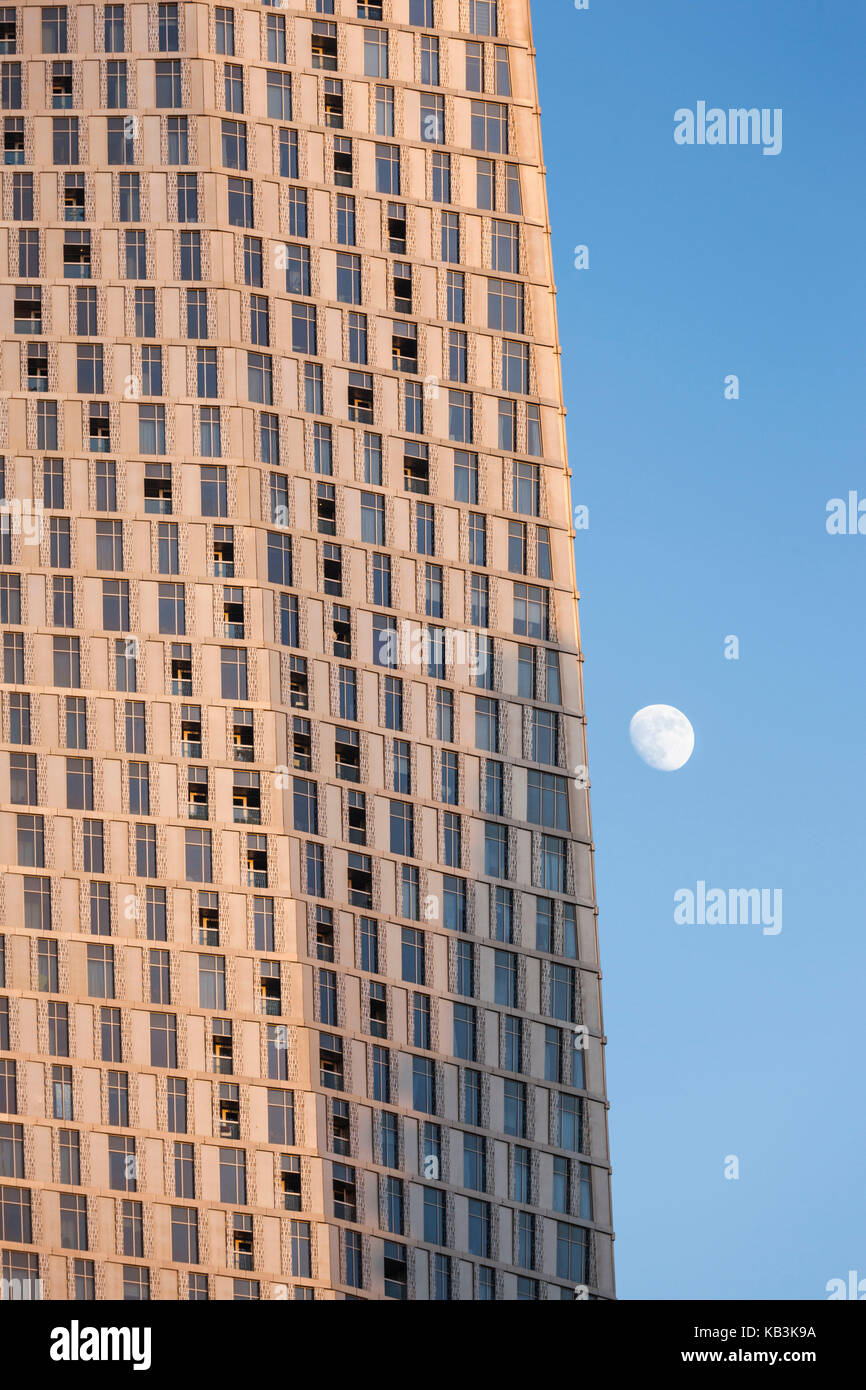 UAE, Dubai, Dubai Marina, the twisted Cayan Tower, with moonrise, dusk ...