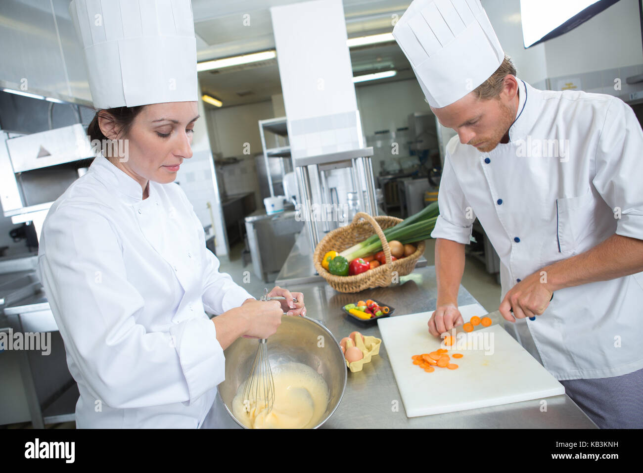 chef and assistant prepare fill for pastries Stock Photo - Alamy