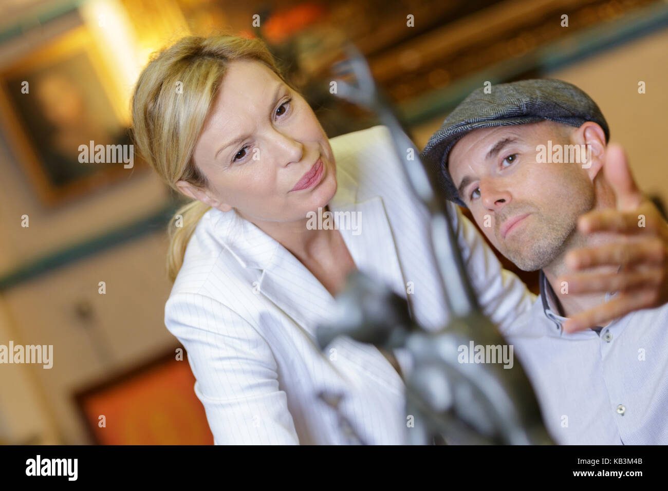 artist looking at the creative sculpture in art gallery Stock Photo - Alamy
