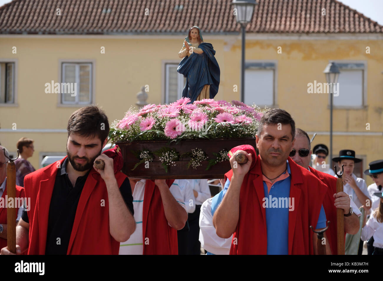 Christian roman catholic procession with statue of the Virgin Mary ...